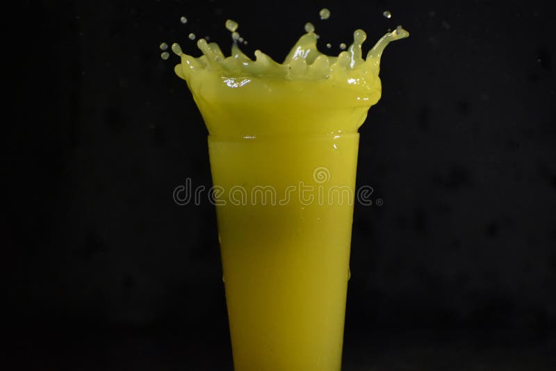 Yellow Coloured Juice Splash Stock Photo - Image of splash, lighting ...