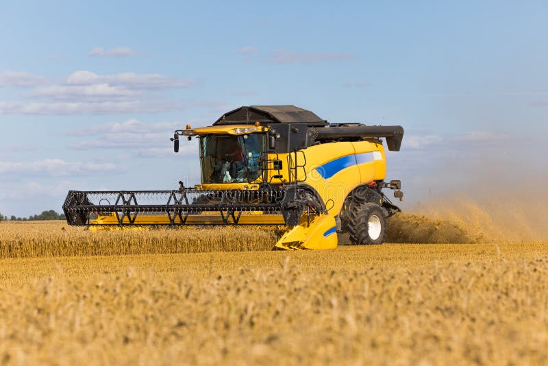 Combine Harvester on a Wheat Field with Tractor Stock Image - Image of ...