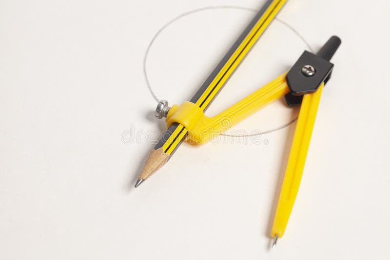 Yellow Compass with Pencil Isolated on White Background Stock Photo ...