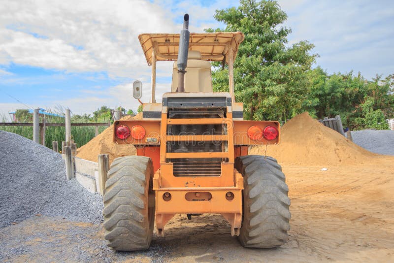 Yellow Construct Tractor Vintage Stock Photo - Image of material ...