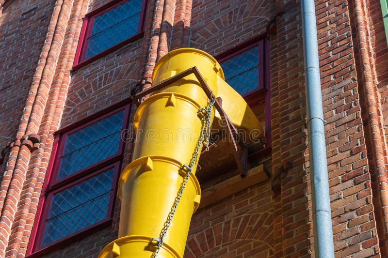 Yellow Construction Chute Attached To Building Stock Image - Image of ...