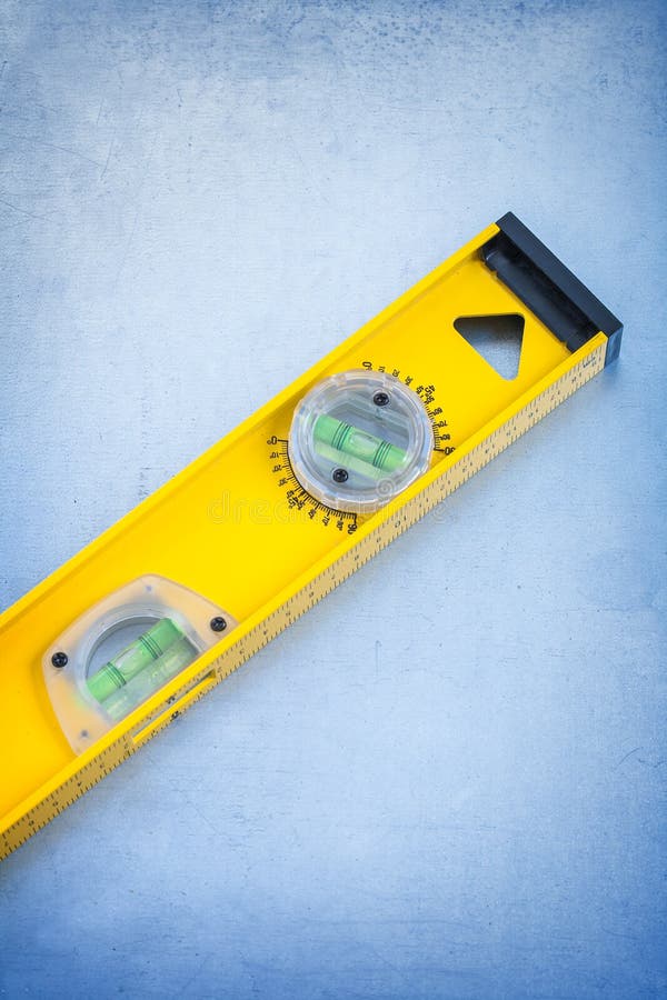 Yellow Construction Level on Metallic Background Stock Image - Image of ...