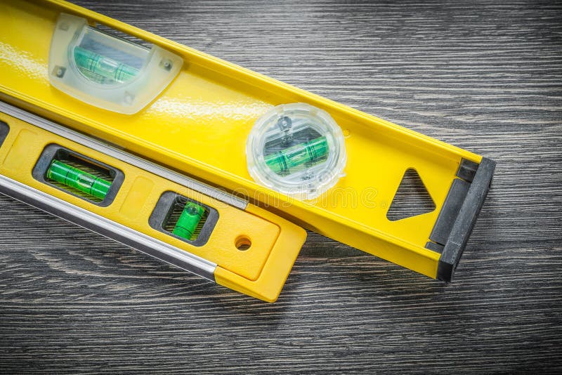 Yellow Construction Levels on Wooden Board Stock Image - Image of ...