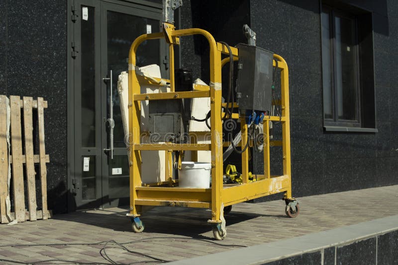 Yellow Construction Platform on Construction Site. Special Elevator for ...
