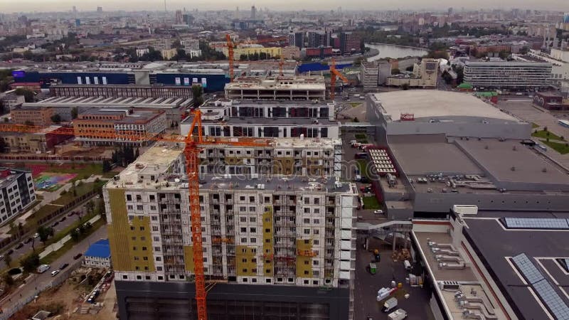 A Yellow Construction Tower Crane is in the Process of Building New ...
