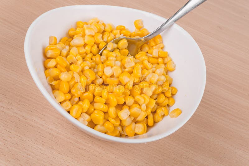 Yellow Corn in a Bowl on the Table Stock Photo - Image of spoon ...