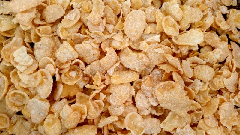 Yellow Corn Flakes Scattered on Flat Surface Closeup Stock Photo ...