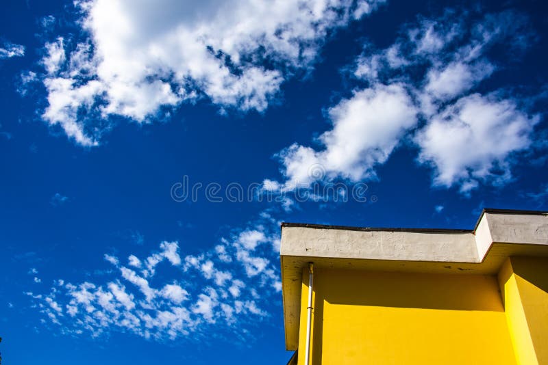 Yellow Corners and Blue Sky Stock Photo - Image of dramatic, city ...
