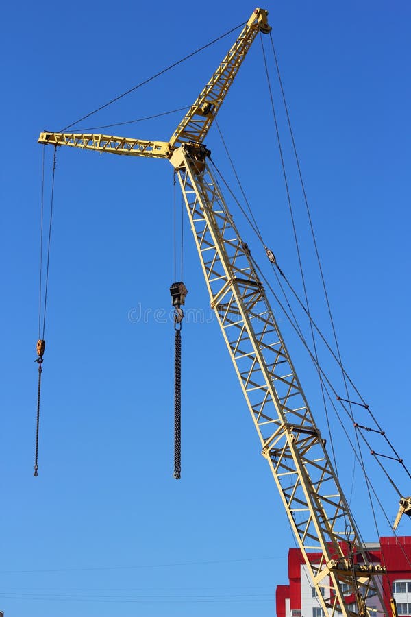 Yellow crane stock image. Image of design, exterior, blue - 25197185