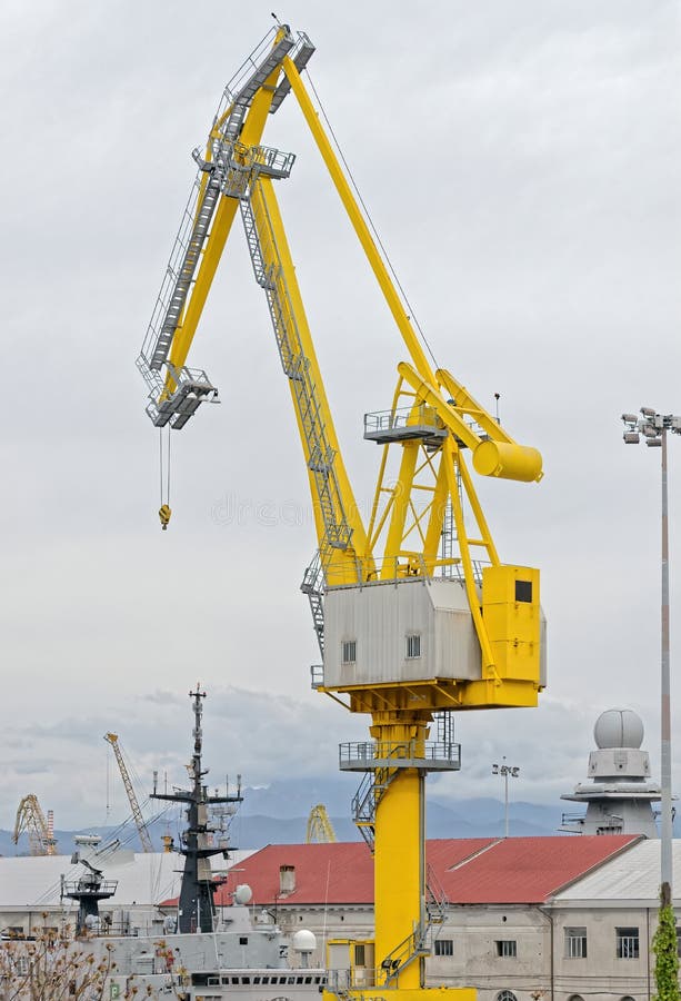 Yellow crane in a shipyard stock photo. Image of industry - 144467378