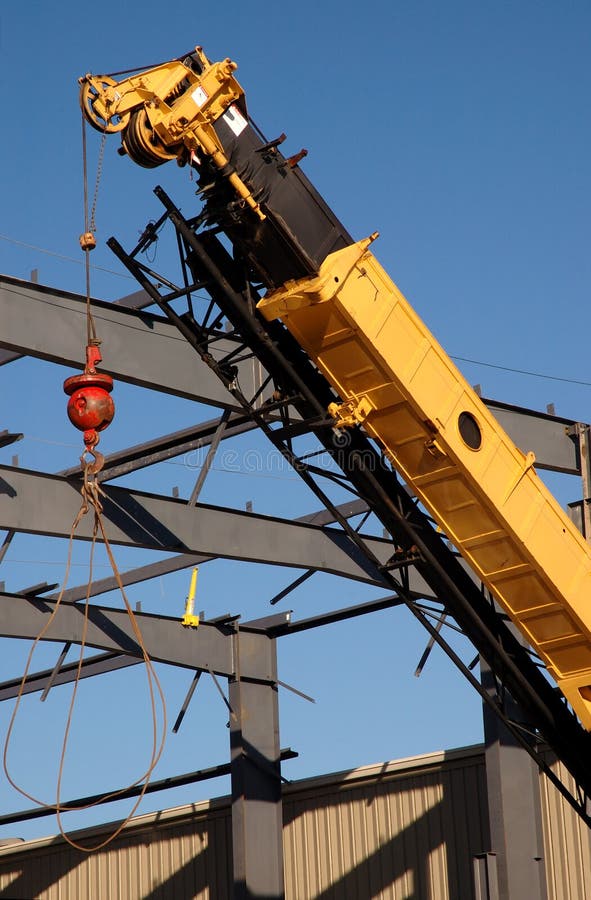 Yellow crane on work site stock photo. Image of material - 3975016