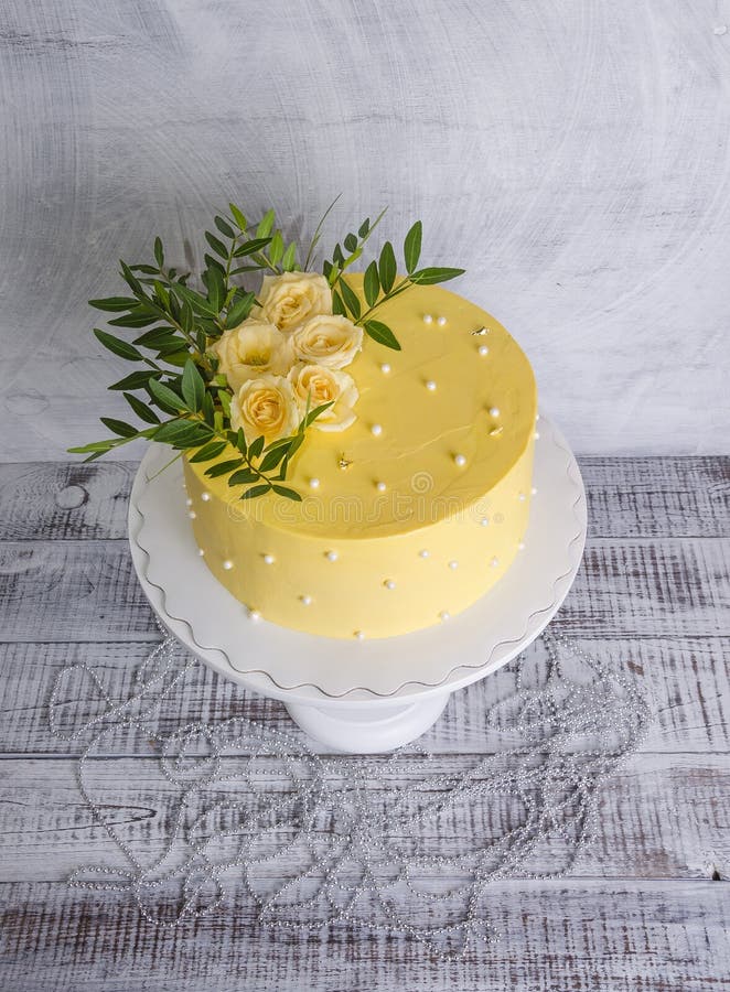Yellow Cream Cheese Cake with Roses and Greenery Stock Photo - Image of ...