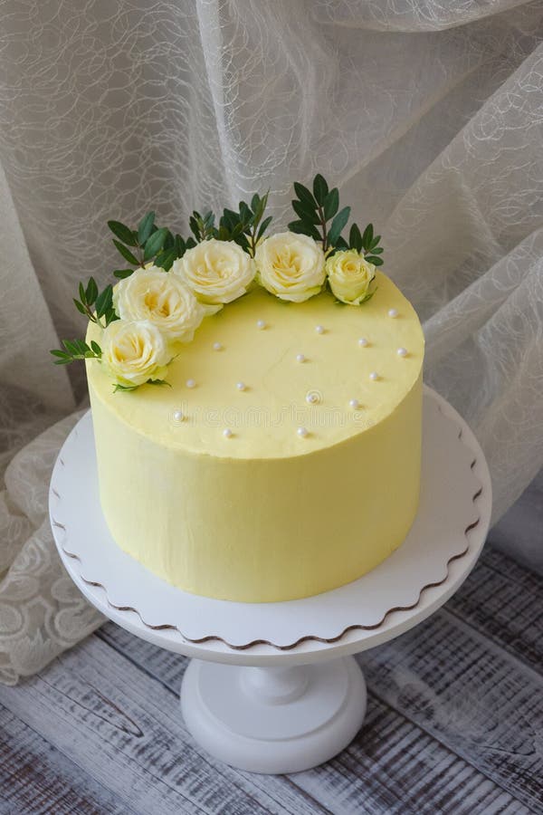 Yellow Cream Cheese Cake with Roses and Greenery Stock Photo - Image of ...