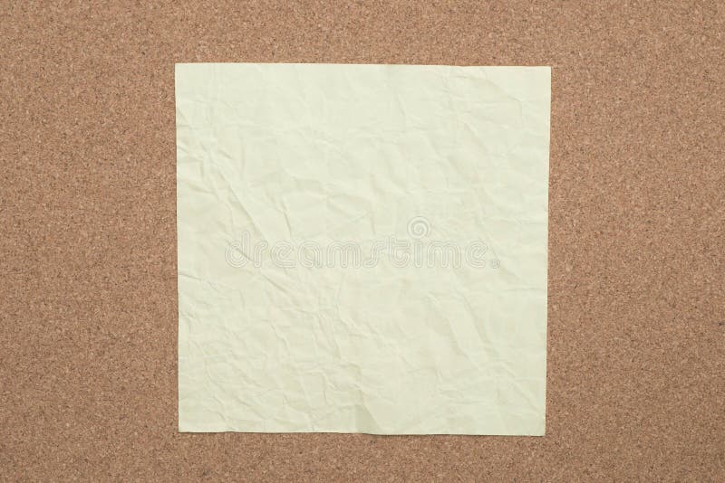 Yellow Creased Paper Note on Cork Background Stock Photo - Image of ...