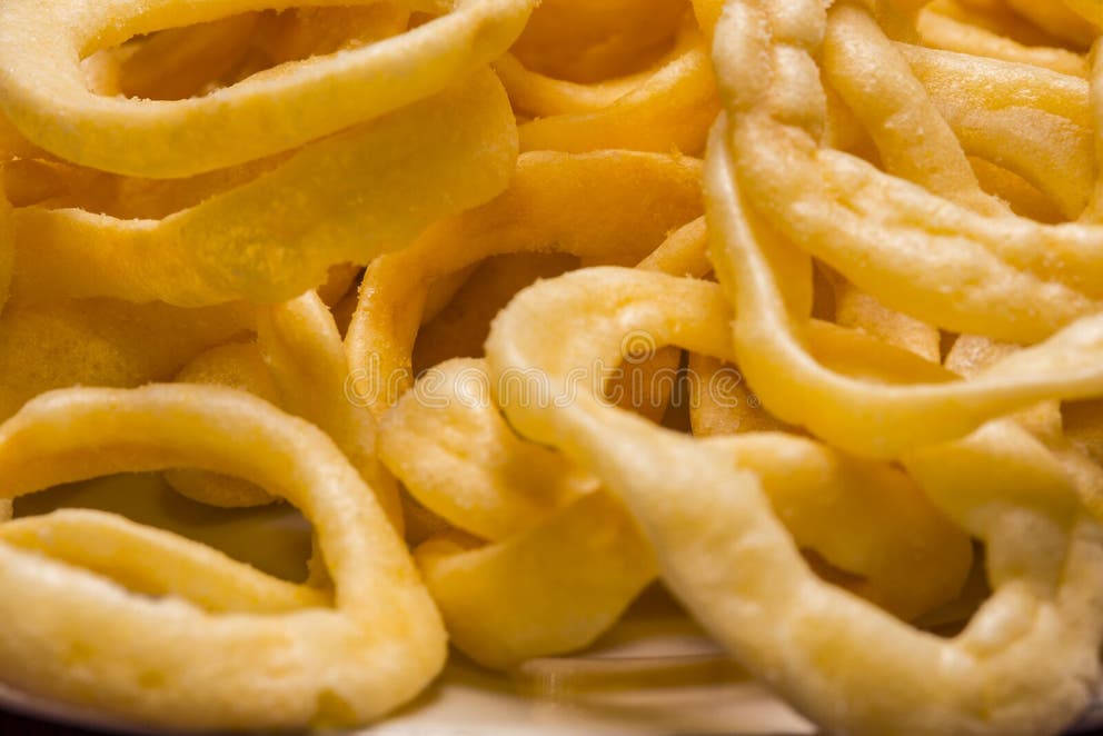 Yellow crisps rings macro stock photo. Image of macro - 38282152