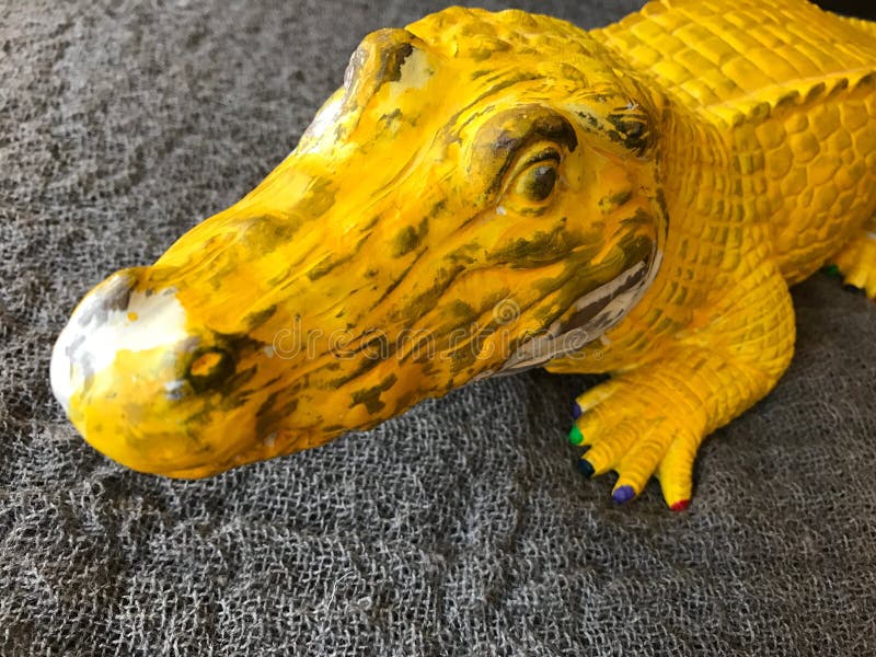 Yellow crocodile 4th stock image. Image of texture, design - 93298221