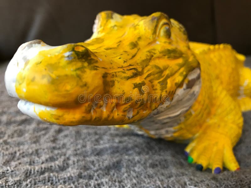 Yellow crocodile stock image. Image of wild, yellow, sculpture - 86614975