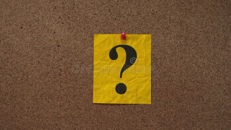 A Yellow Crumpled Adhesive Note with a Question Mark on it Pinned To a ...