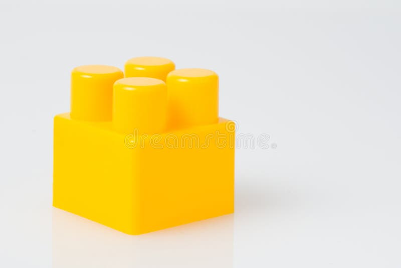 Yellow Cube Block Constructor on a White Background with Copy Space ...
