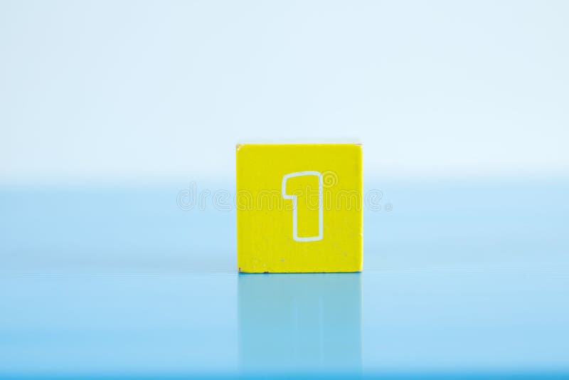 Yellow Cube with the Number 1 on it Isolated on a Blue Gradient ...