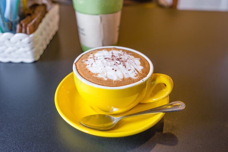 Yellow Cup of Coffee on Cafe Table Stock Photo - Image of cafe ...