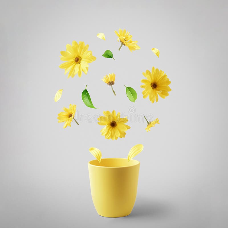 Yellow Cup with Flying Yellow Flowers on a Gray Background. the Concept ...