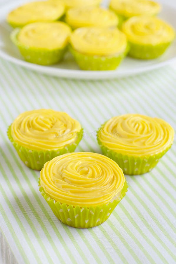 Yellow Cupcakes in Green Paper Baking Cups Stock Photo - Image of candy ...