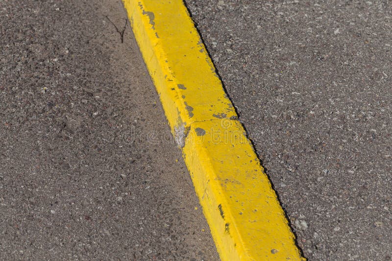 Yellow curb stone border stock photo. Image of black - 274308840