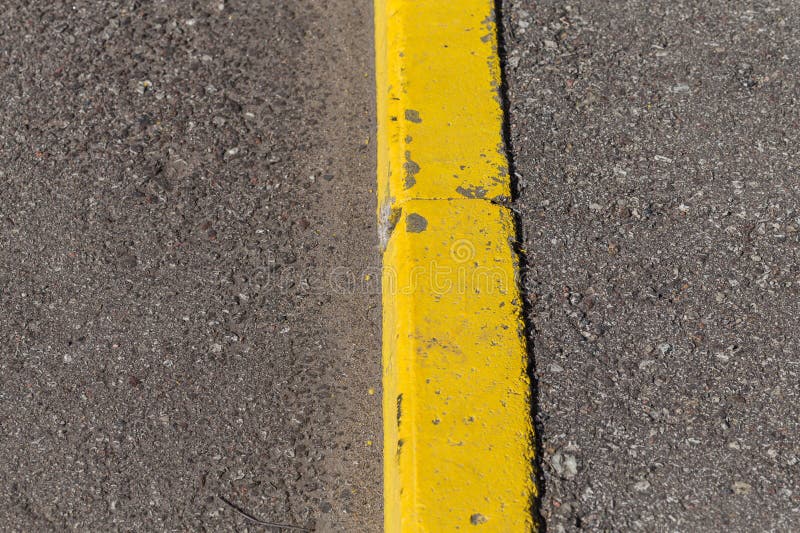 Yellow curb stone border stock image. Image of closeup - 274308875