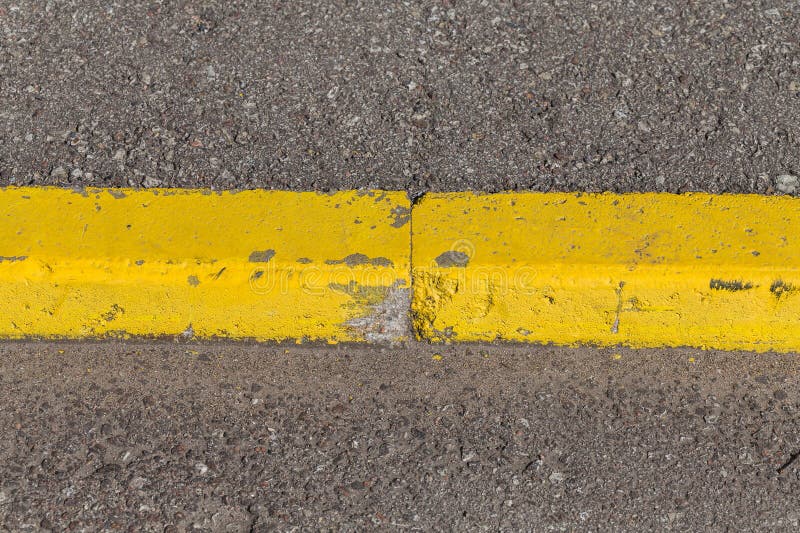 Yellow curb stone border stock photo. Image of earth - 276874390