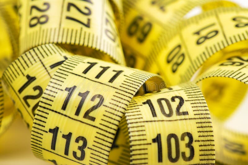 Yellow Curved Measuring Tape Close Up Stock Photo - Image of turning ...