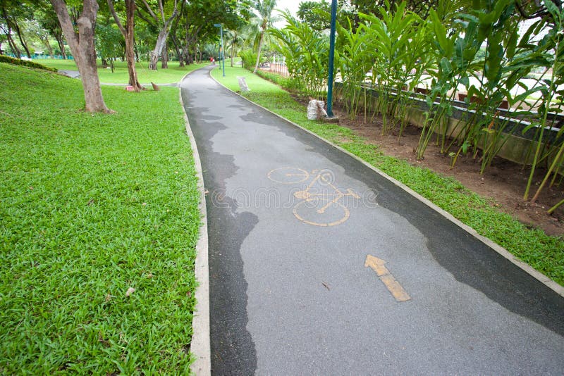 Yellow Cycle Track and Garden View Stock Photo - Image of asphalt ...
