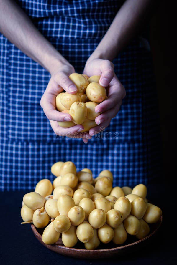 Fresh Yellow Dates in Hand stock image. Image of arabian - 207472627