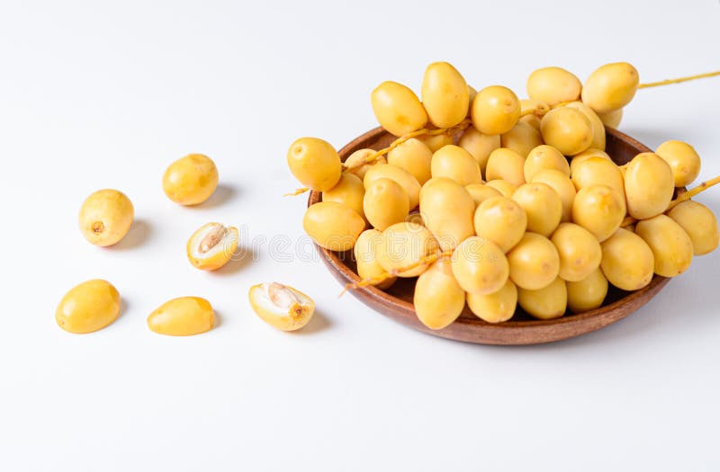 Wooden Platter with Full of Fresh Yellow Dates with Seeds Stock Photo ...