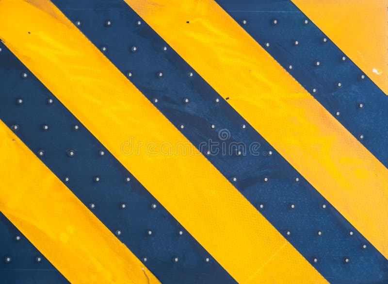 Yellow Diagonal Stripes between Parallel Lines Painted on a Paved Road ...