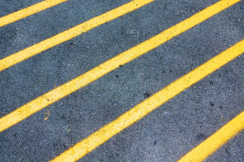 Yellow Diagonal Lines Marking on Asphalt Road Stock Photo - Image of ...