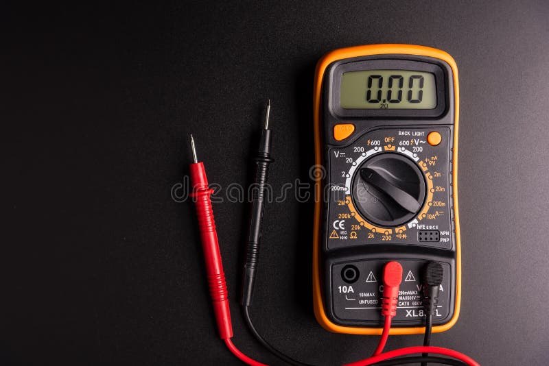 Yellow Digital Multimeter with Probes on Black Background , a ...