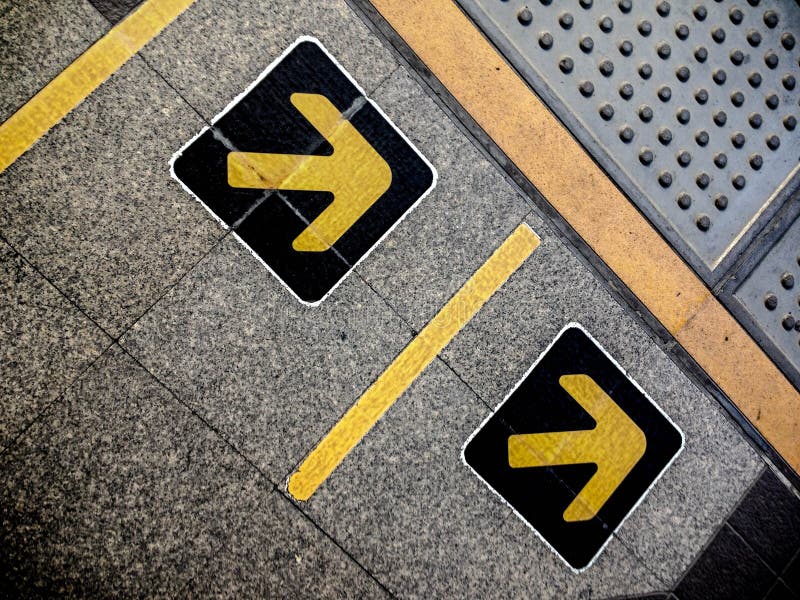 Walkway with Direction Arrow Yellow Pavement in Japan Subway Stock ...