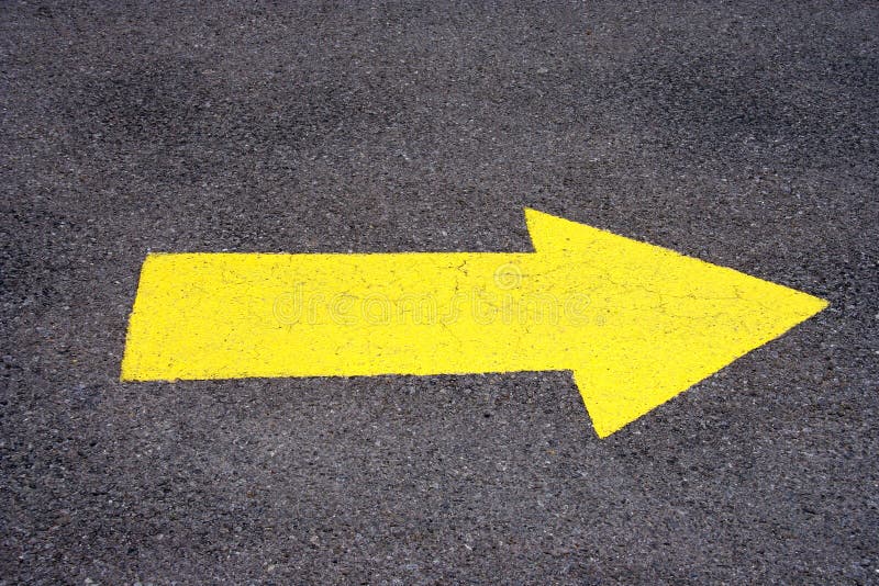 Yellow Directional Arrow stock image. Image of blacktop - 6159625