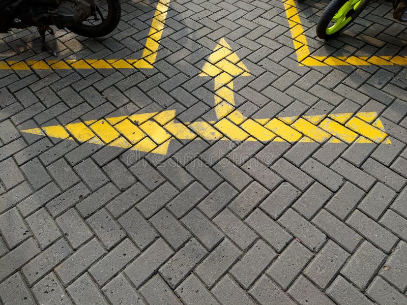 Yellow Directional Sign in the Motorcycle Parking Area Stock Image ...
