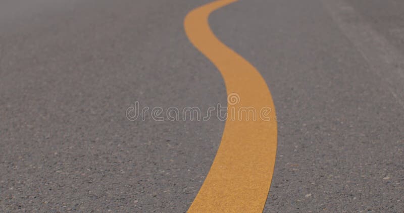Yellow Dividing Strip on an Asphalt Road. Dashed Line Changes To Solid ...