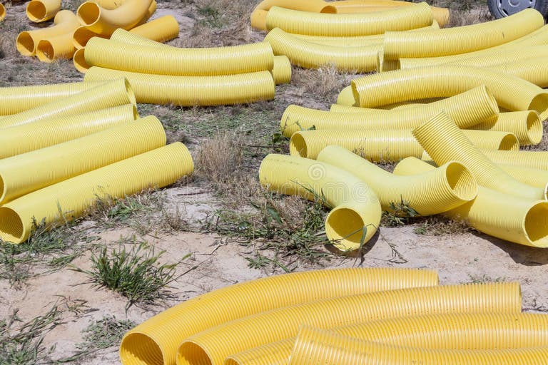 Yellow drain pipe stock photo. Image of green, industry - 98016772