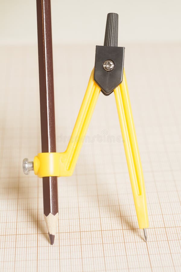 Yellow Drawing Compass on Graph Stock Image - Image of measurement ...