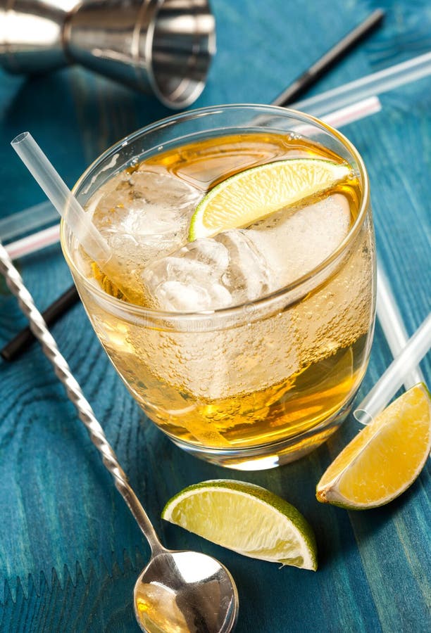 Yellow Drink on a Blue Background Stock Photo - Image of straws, goblet ...