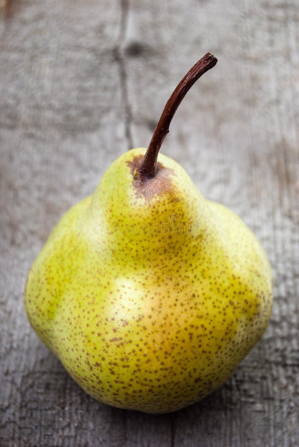 Yellow Duchess Pear on Wood Stock Photo - Image of full, plant: 30864954