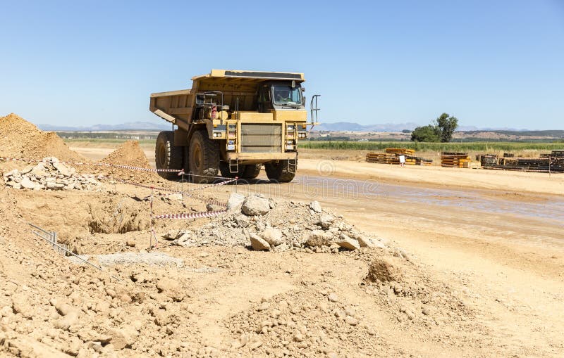 Yellow Dump Truck on a Construction Site Stock Photo - Image of ...