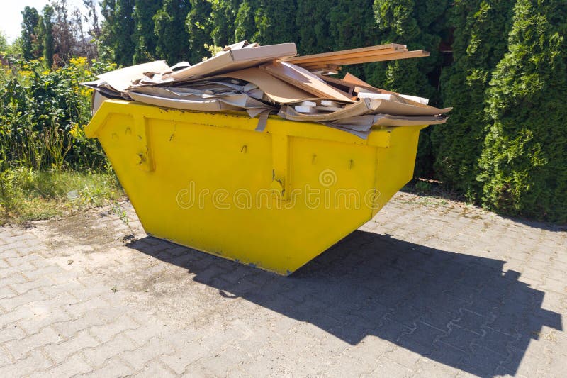 Yellow Dumpster Filled with Construction Debris Stock Photo - Image of ...