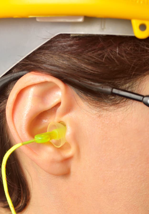 Yellow Earplug into the Ear Stock Image - Image of industrial, quiet ...