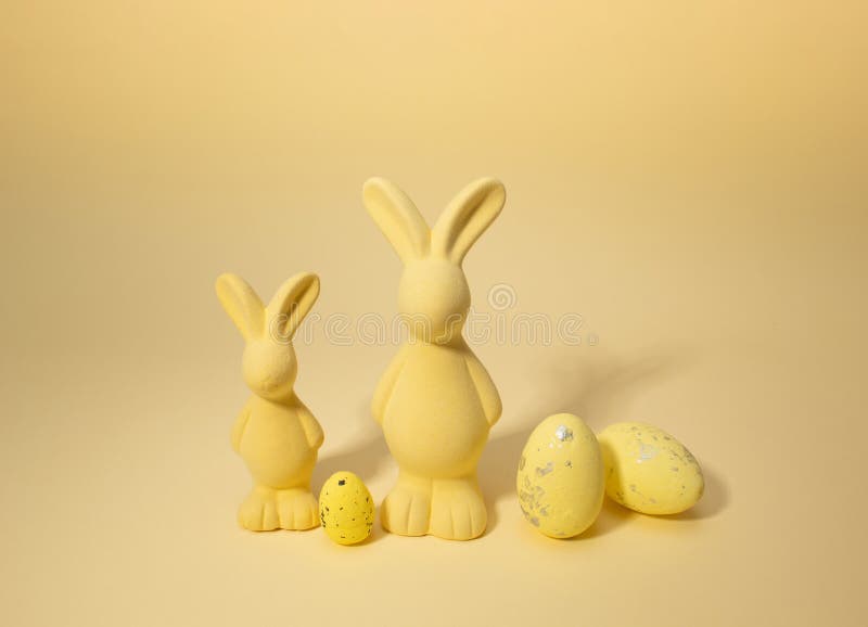 Yellow Easter Bunnies and Eggs on Yellow Background. Happy Easter ...