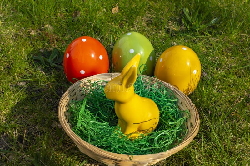 Yellow Easter Bunny and Colorful Easter Eggs Made of Pottery with a ...